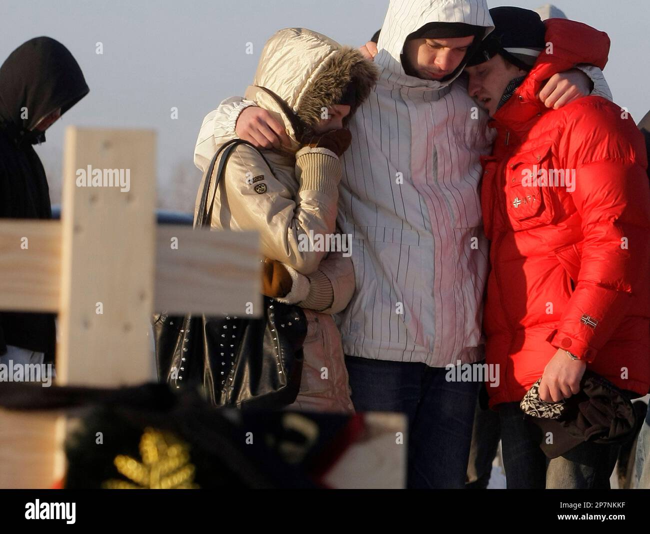 Grieving relatives of Timur Parfiliev, a victim of a nightclub fire ...