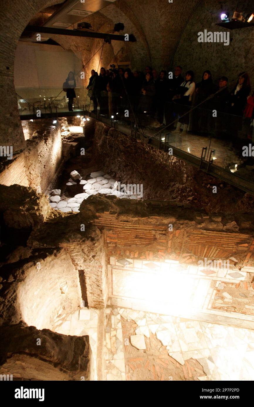 Visitors look at new discoveries unveiled in Rome, Thursday, Dec. 3 ...