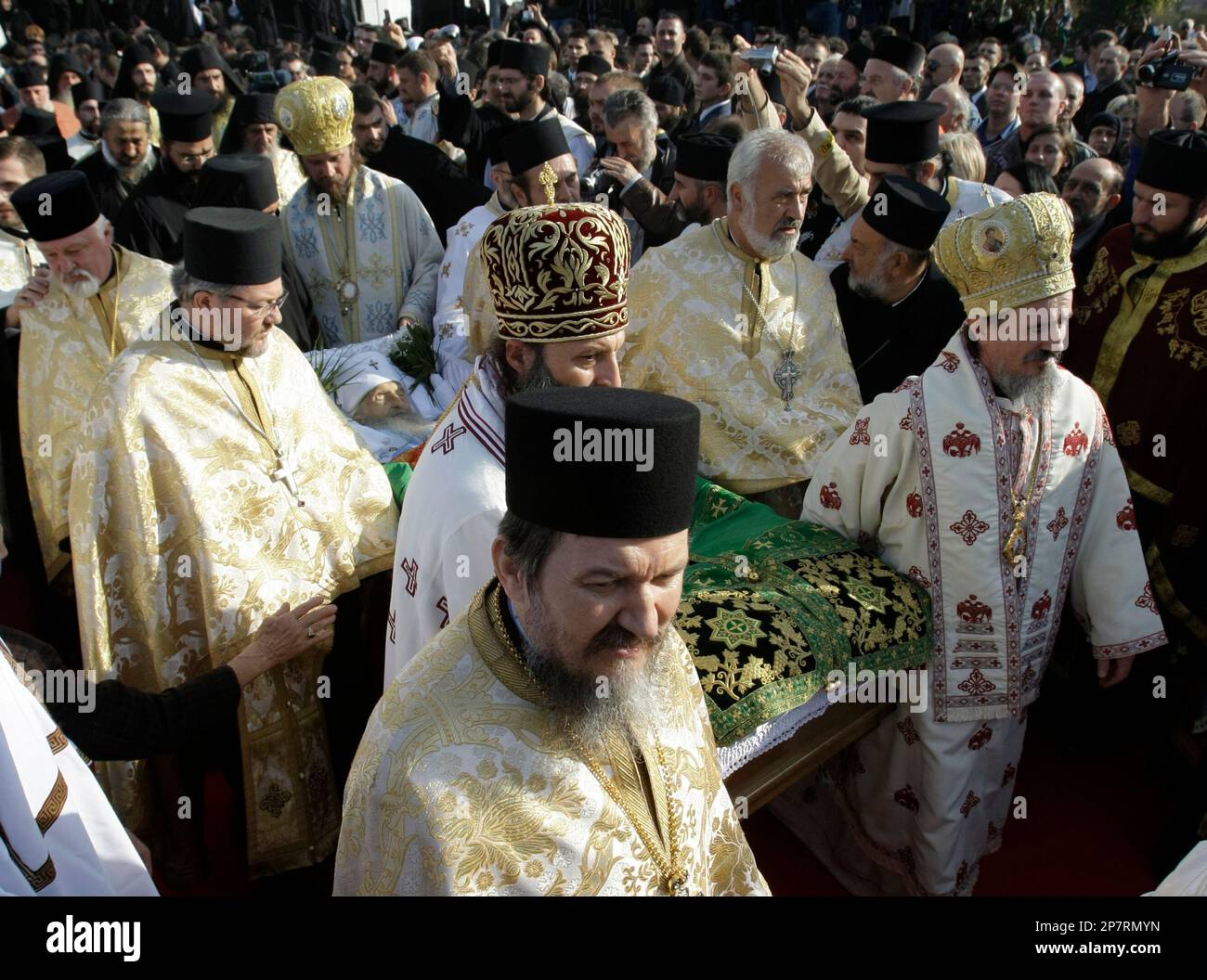 Church Leaders Hold The Coffin Of Patriarch Pavle During The Funeral