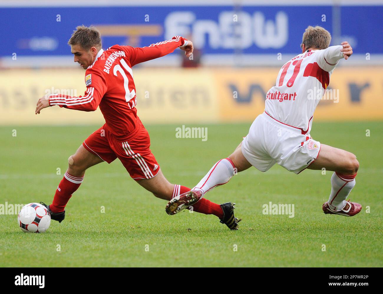 Munich's Philipp Lahm, left, challenges for the ball with Stuttgart's ...