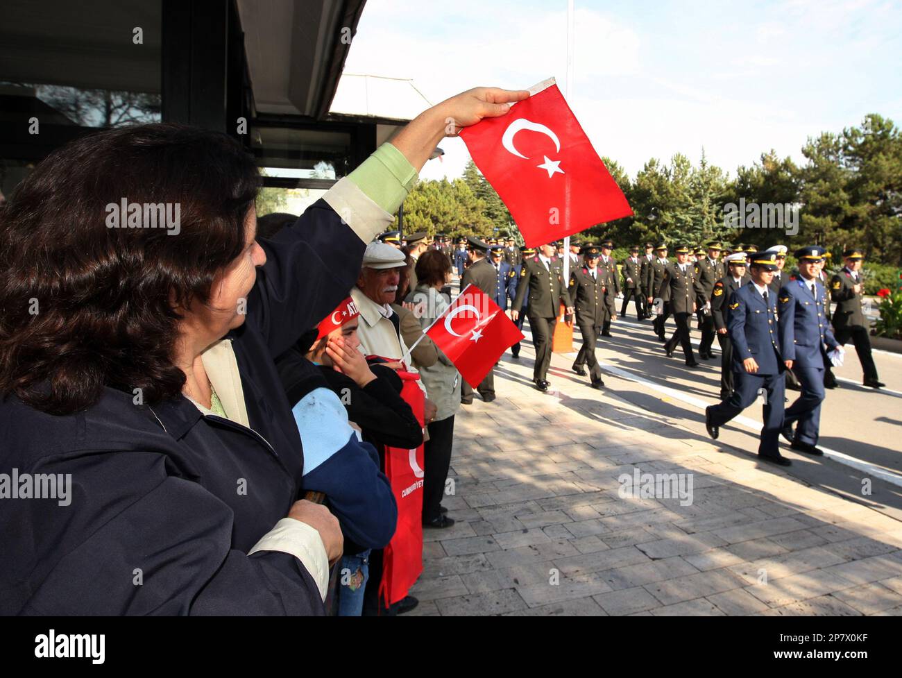 People cheer the army officers at the entrance of the mausoleum of ...