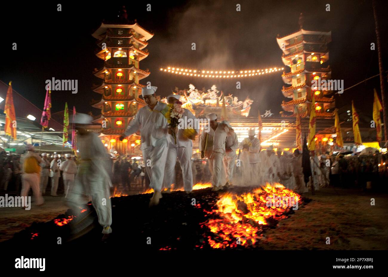 Malaysian ethnic Chinese walk barefoot over burning coals on the final ...