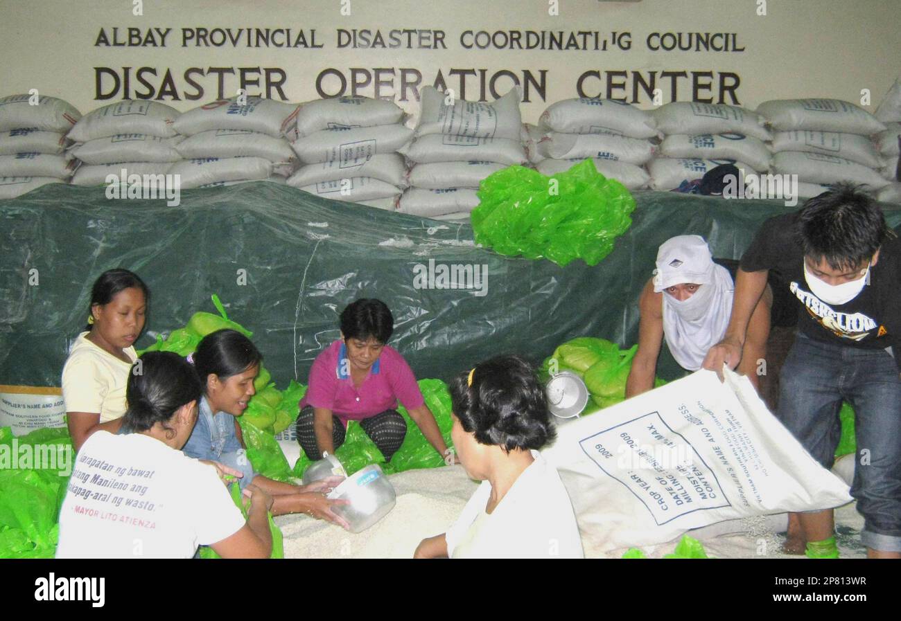 Emergency workers pack relief bags at the Emergency Evacuation Center ...