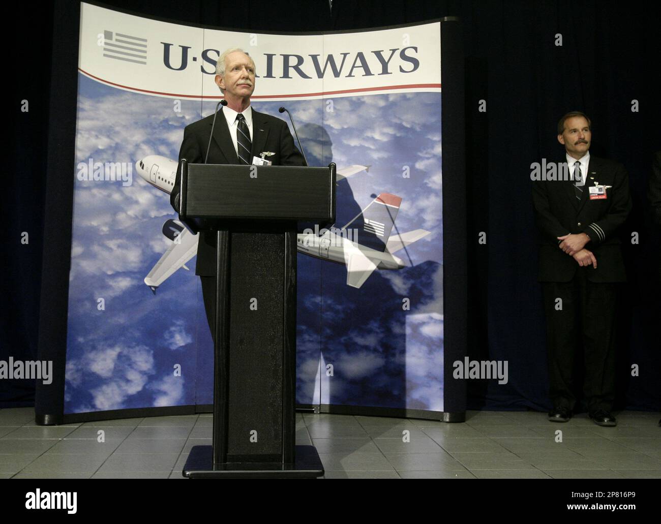 Pilot Chesley Sullenberger, left, and co-pilot Jeff Skiles listen to ...