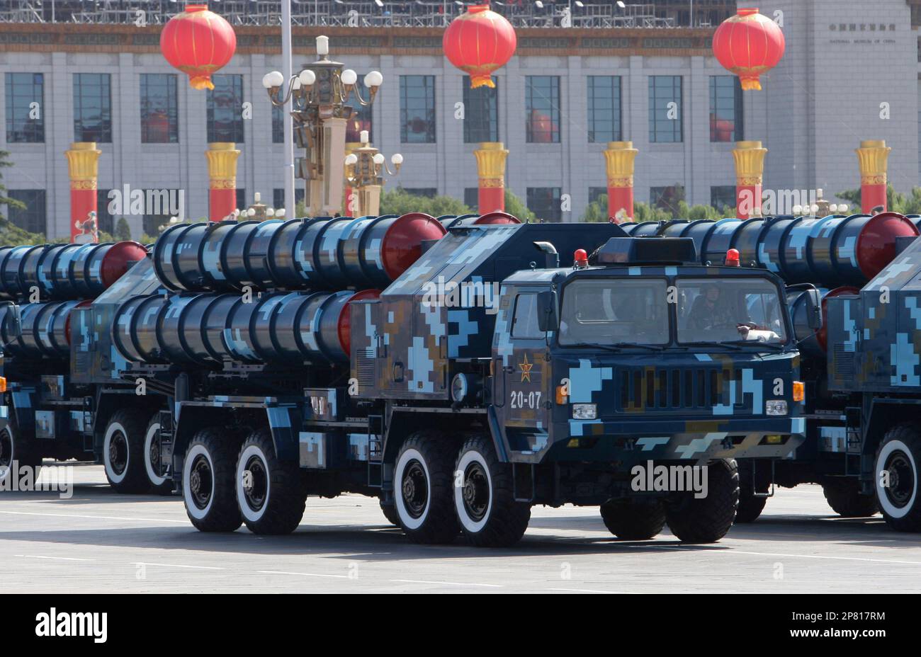 Chinese People's Liberation Army missile carrier trucks drive past the ...