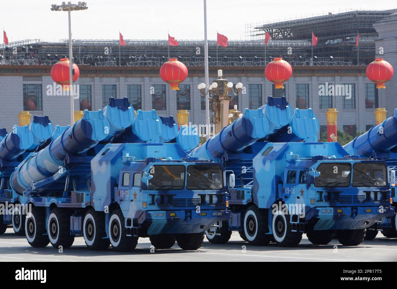Chinese People's Liberation Army missile carrier trucks drive past the ...