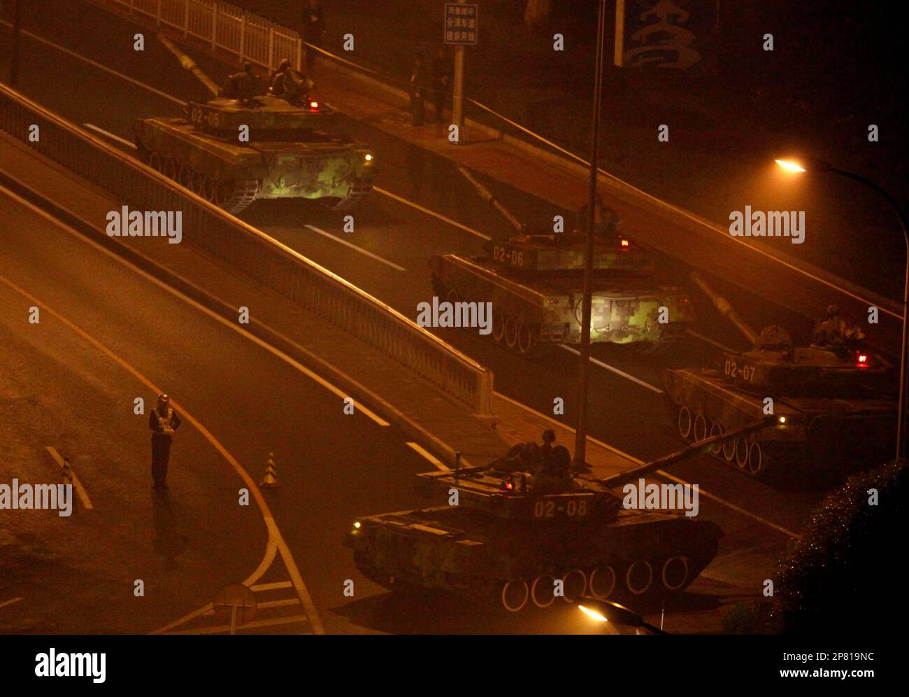 Tanks make their way to a military parade marking China's 60th ...