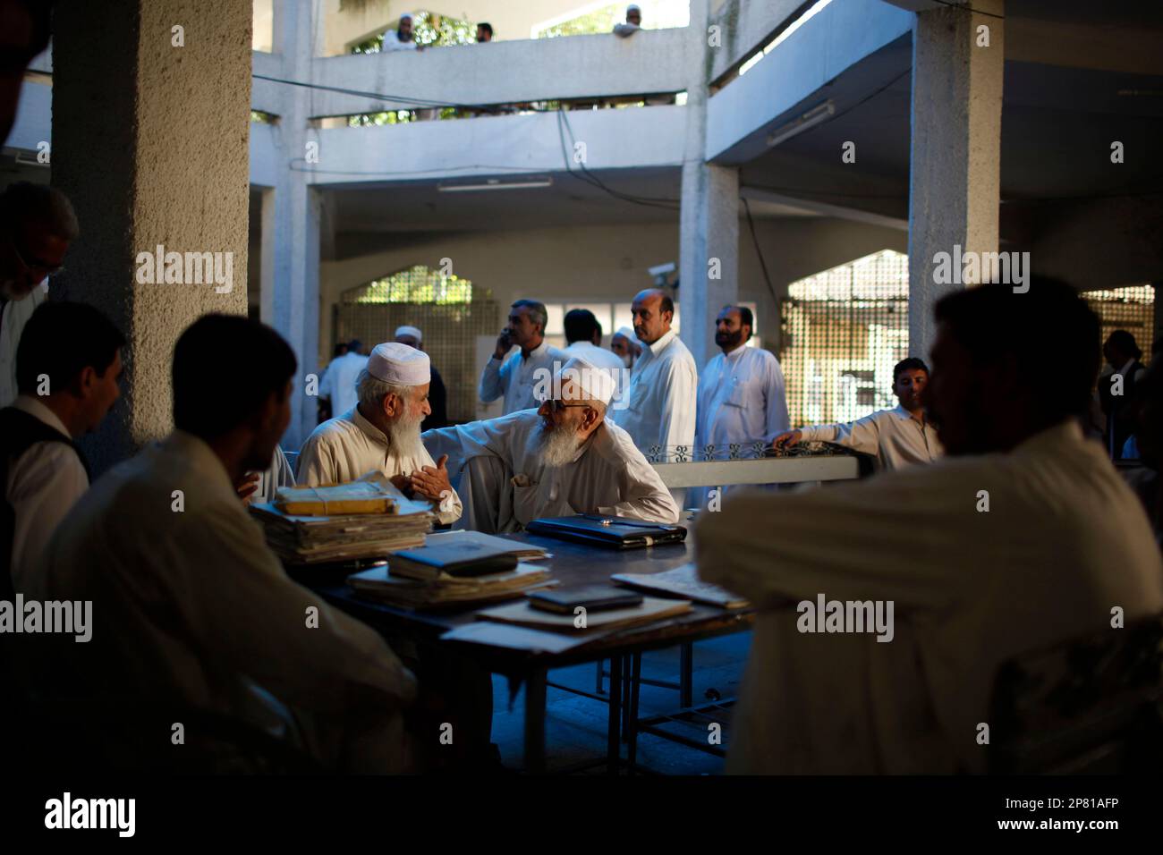 In this photo taken Tuesday, Sept. 29, 2009, lawyers and other court ...