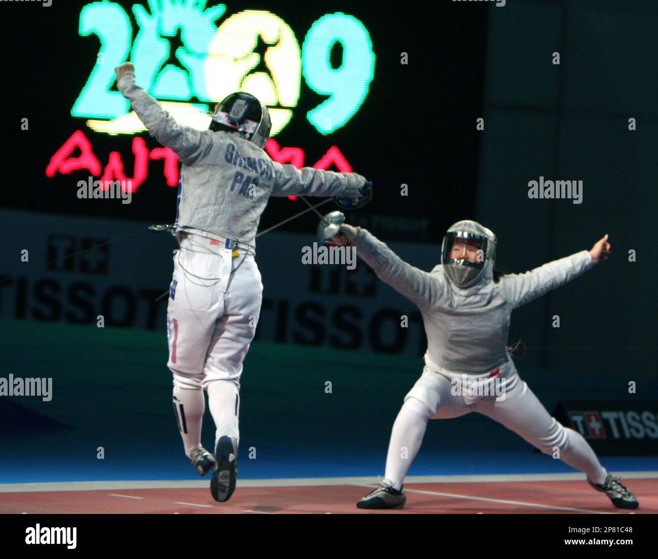 Eileen Grench of Panama, left, and Keum Hwa Kim of Korea compete during ...