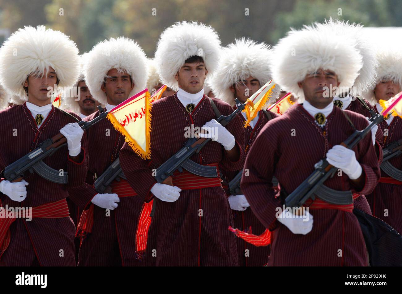 Wearing their traditional uniforms, a group of Iranian Turkmen, who are ...