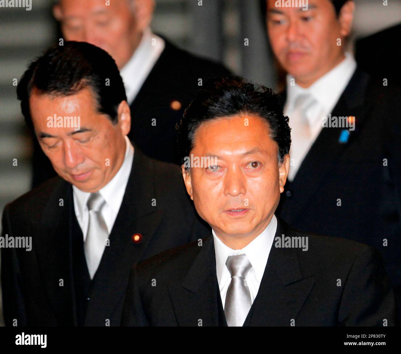 Japan's new Prime Minister Yukio Hatoyama walks in with his Cabinet ...