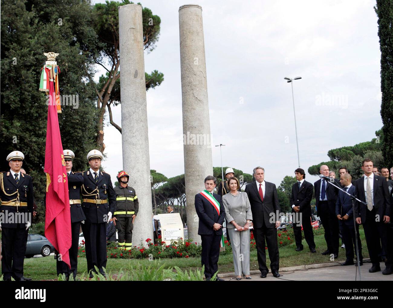 U.S. House Speaker Nancy Pelosi, center, wearing grey suit, flanked by ...