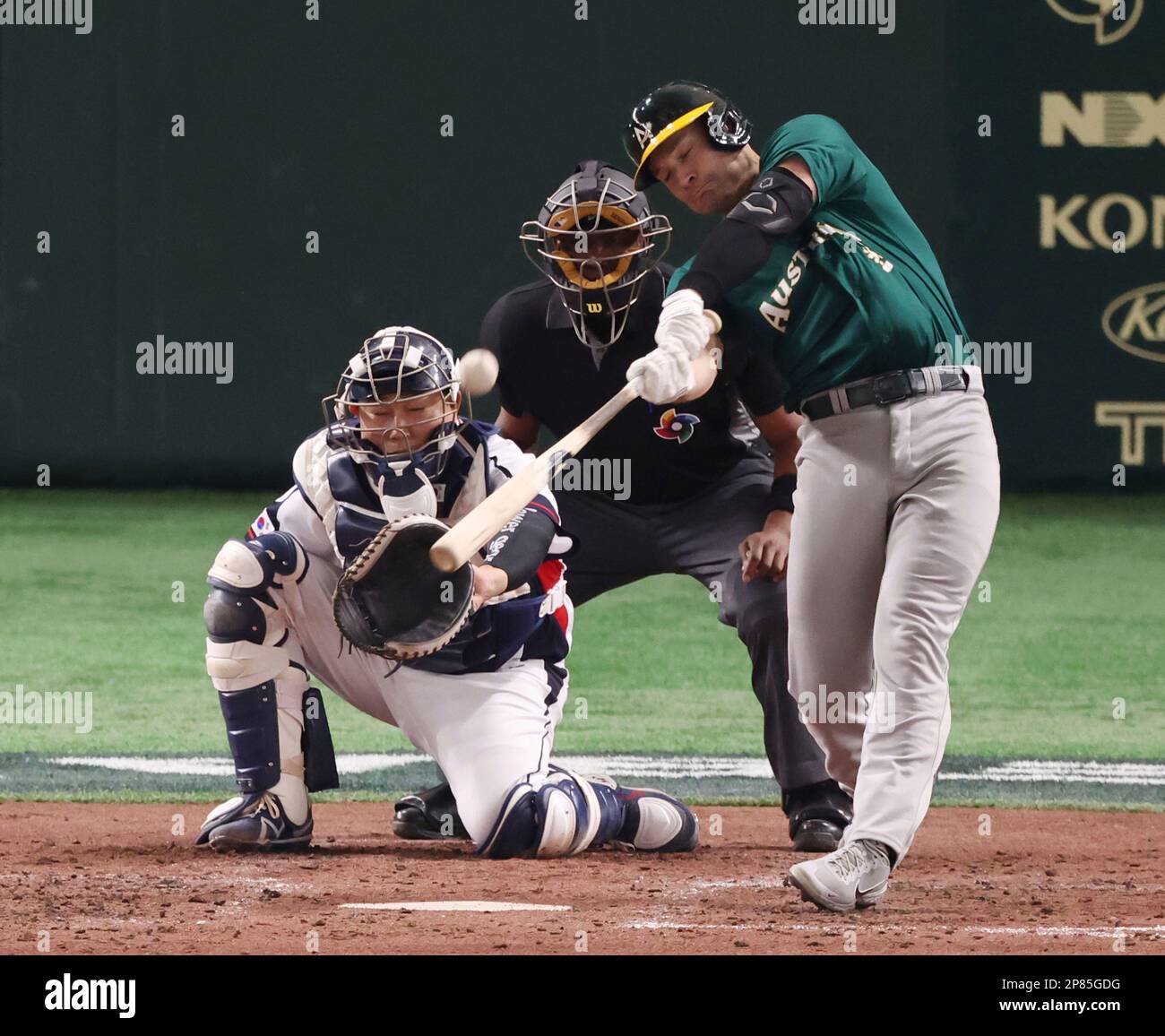Australia's Tim Kennelly homers on a fly ball to left center field in ...