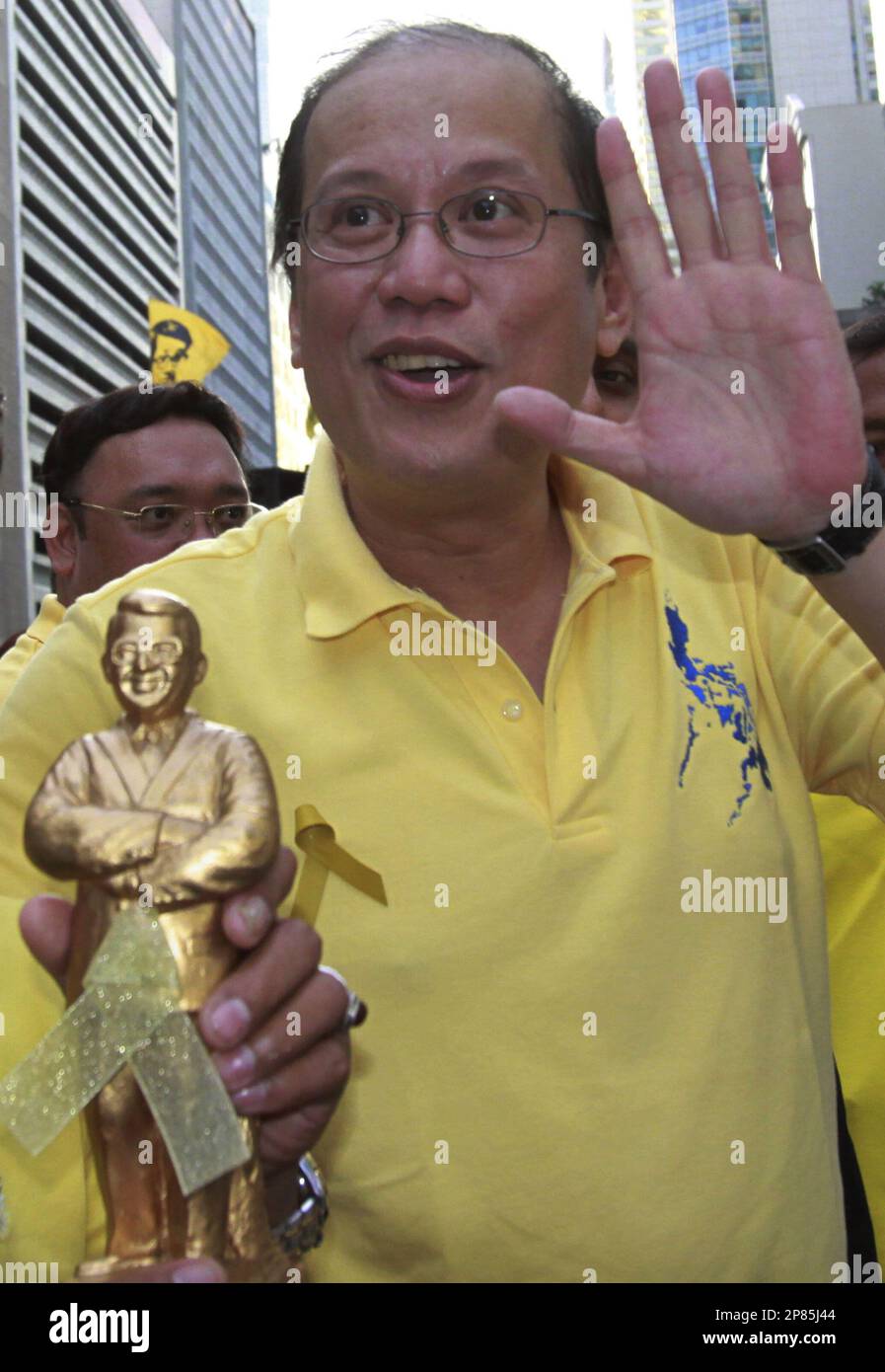 Senator Benigno "Noynoy" Aquino III waves during the commemoration of ...
