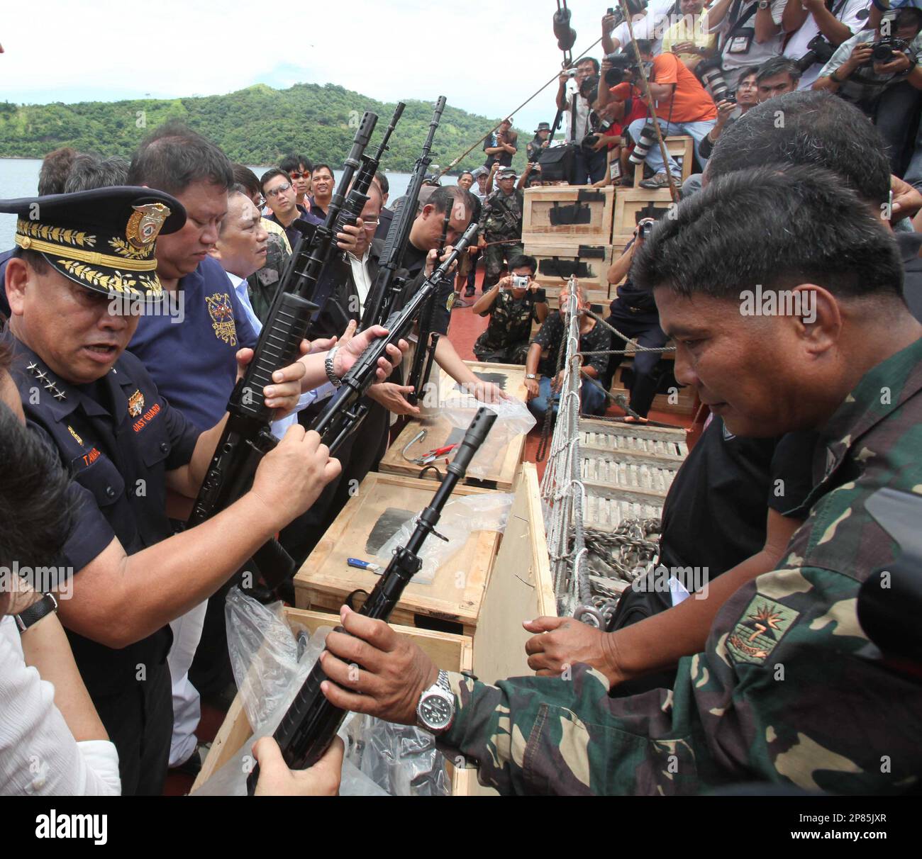 Philippine Coast Guard Chief Vice-Admiral Wilfredo Tamayo, left, and ...