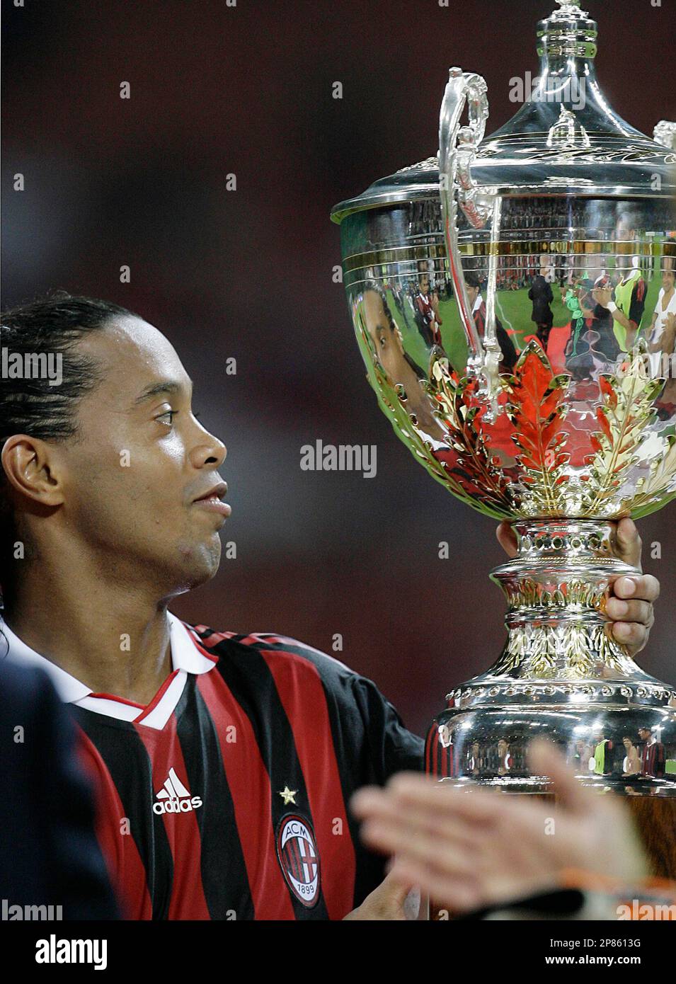 AC Milan's Brazilian forward Ronaldinho raises the cup after winning ...
