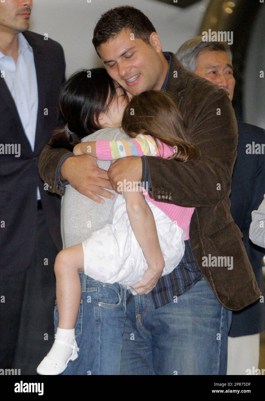 Euna Lee, left, an American journalist who was arrested in March after allegedly crossing into ...