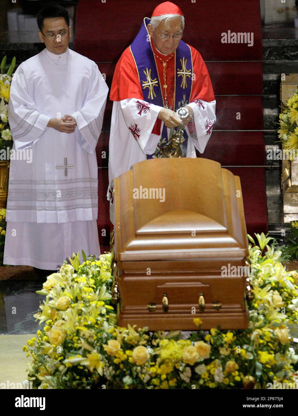 Cardinal Gaudencio Rosales, Archbishop of Manila, blesses the late ...
