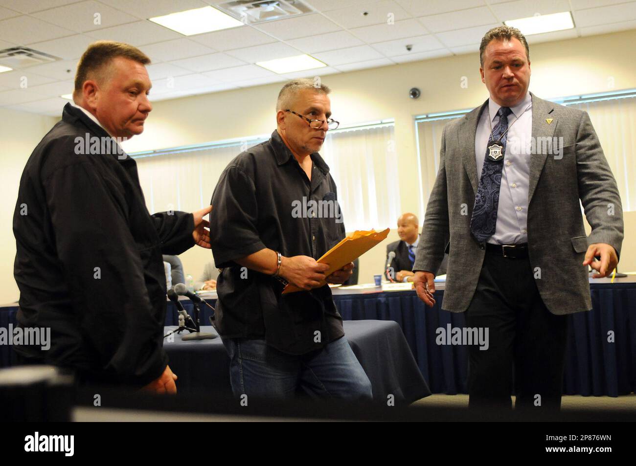 James Riva, center, a Massachusetts man dubbed the Vampire Killer after ...