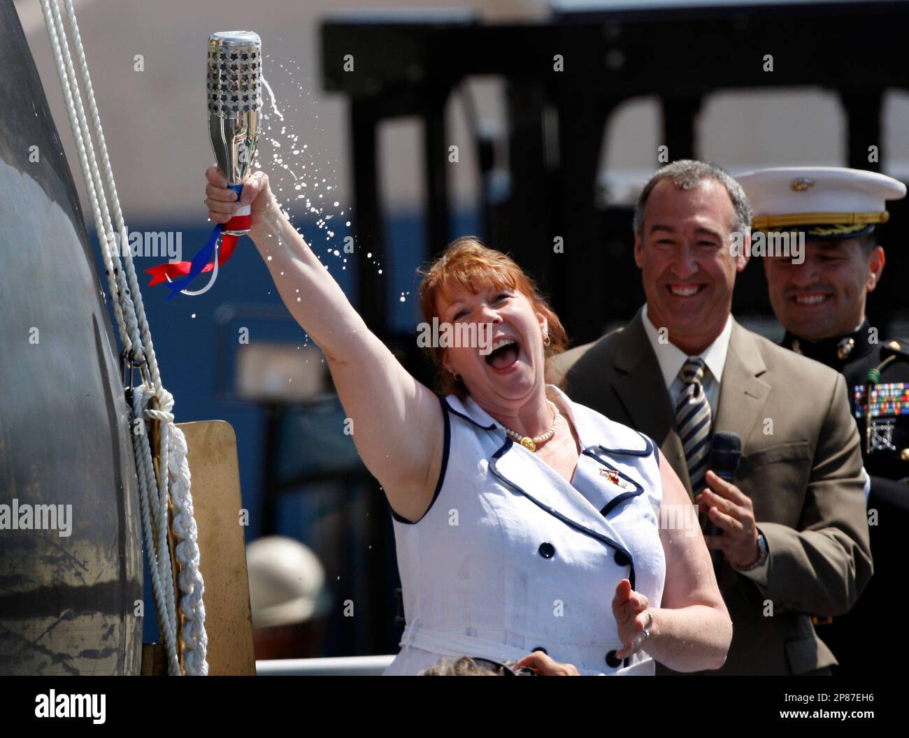 Debra Ann Dunham celebrates during the christening ceremony of the USS ...