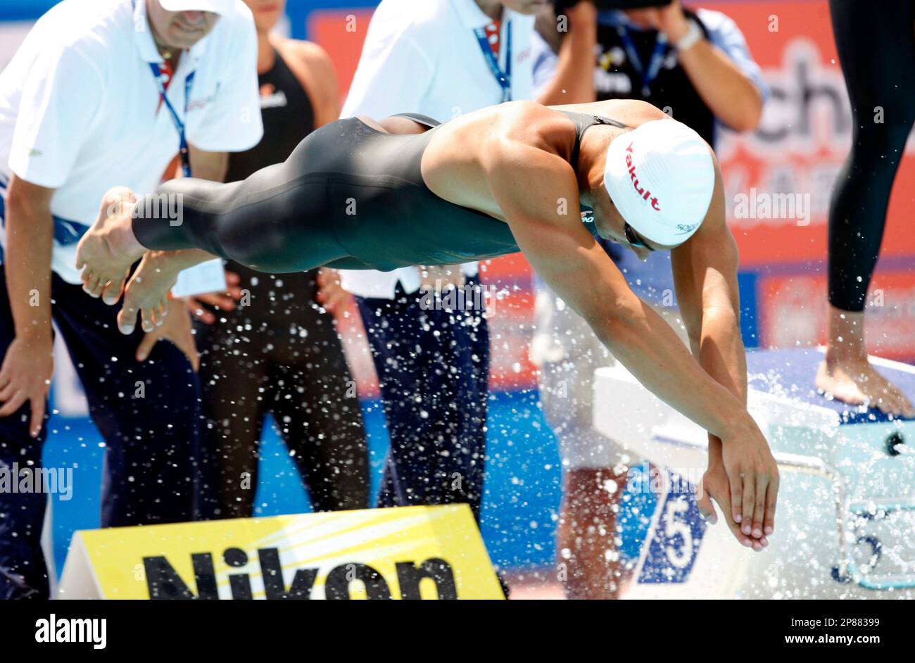 Ricky Berens of the United States dives into the pool wearing a ...