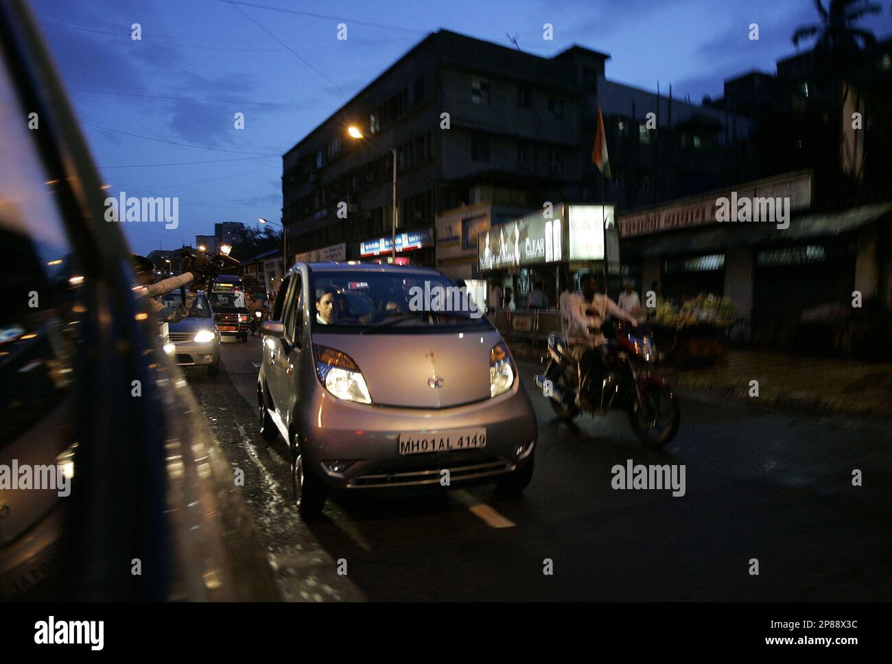 Ashok Vichare, owner of the first Tata Nano car, drives his car on a ...