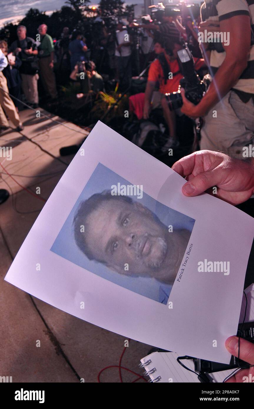 Members Of The Press And Public Look Over A Handout Photo Of The