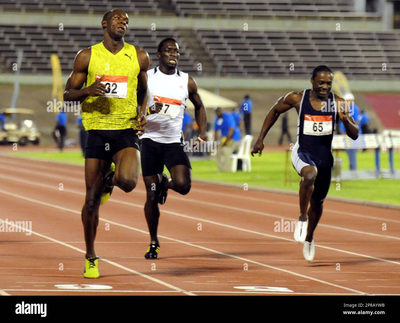 Olympic sprint double champion Usain Bolt, left, approaches to the ...