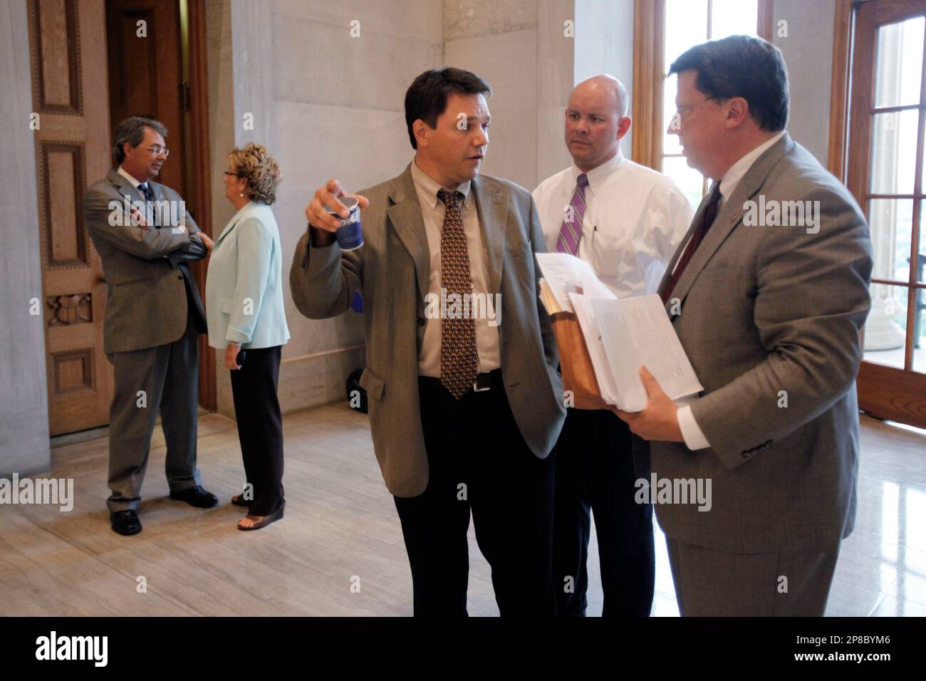 Rep. Joe McCord, R-Maryville, front left, talks with Rep. Jason ...
