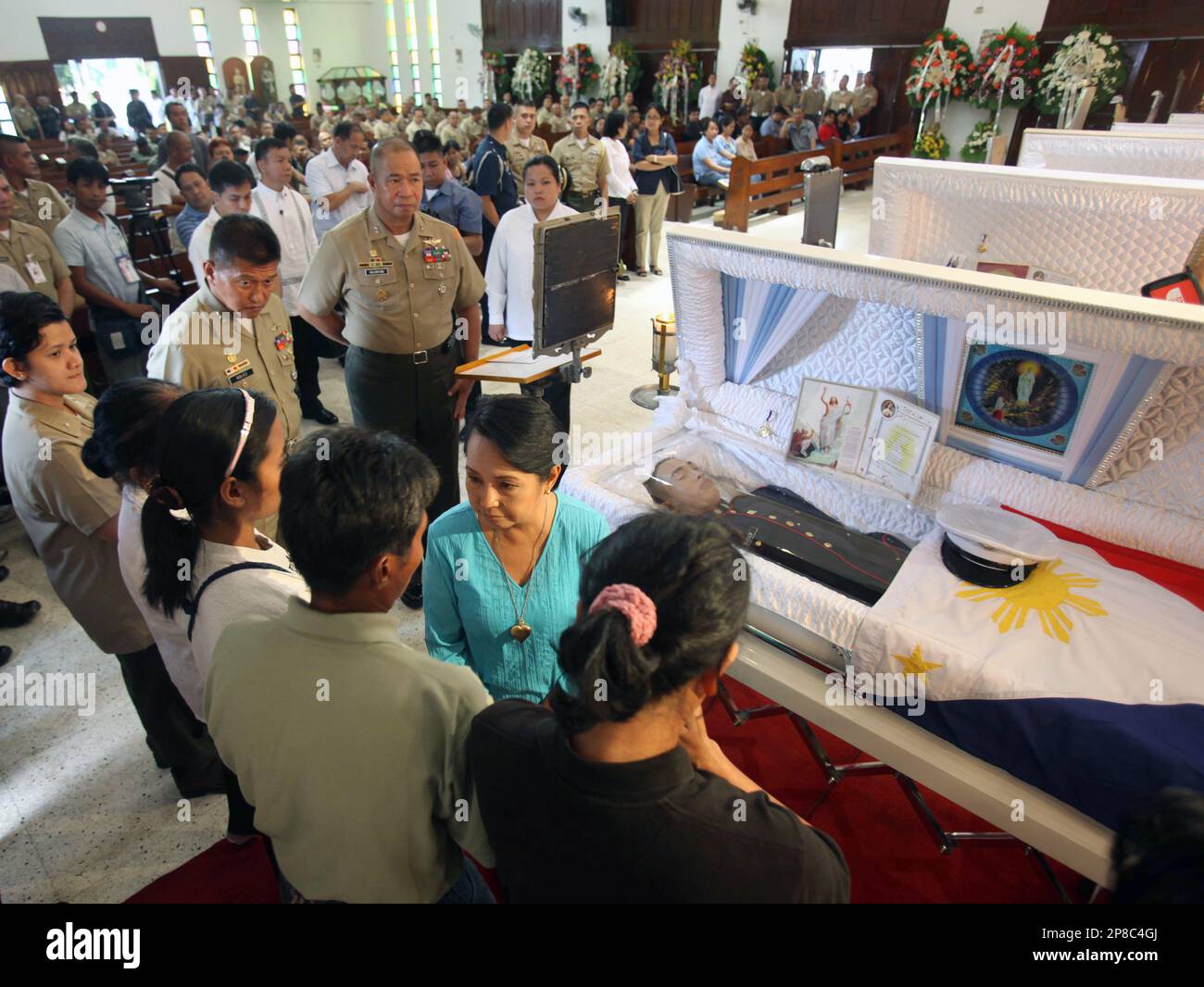 Philippine President Gloria Macapagal Arroyo, center facing camera ...