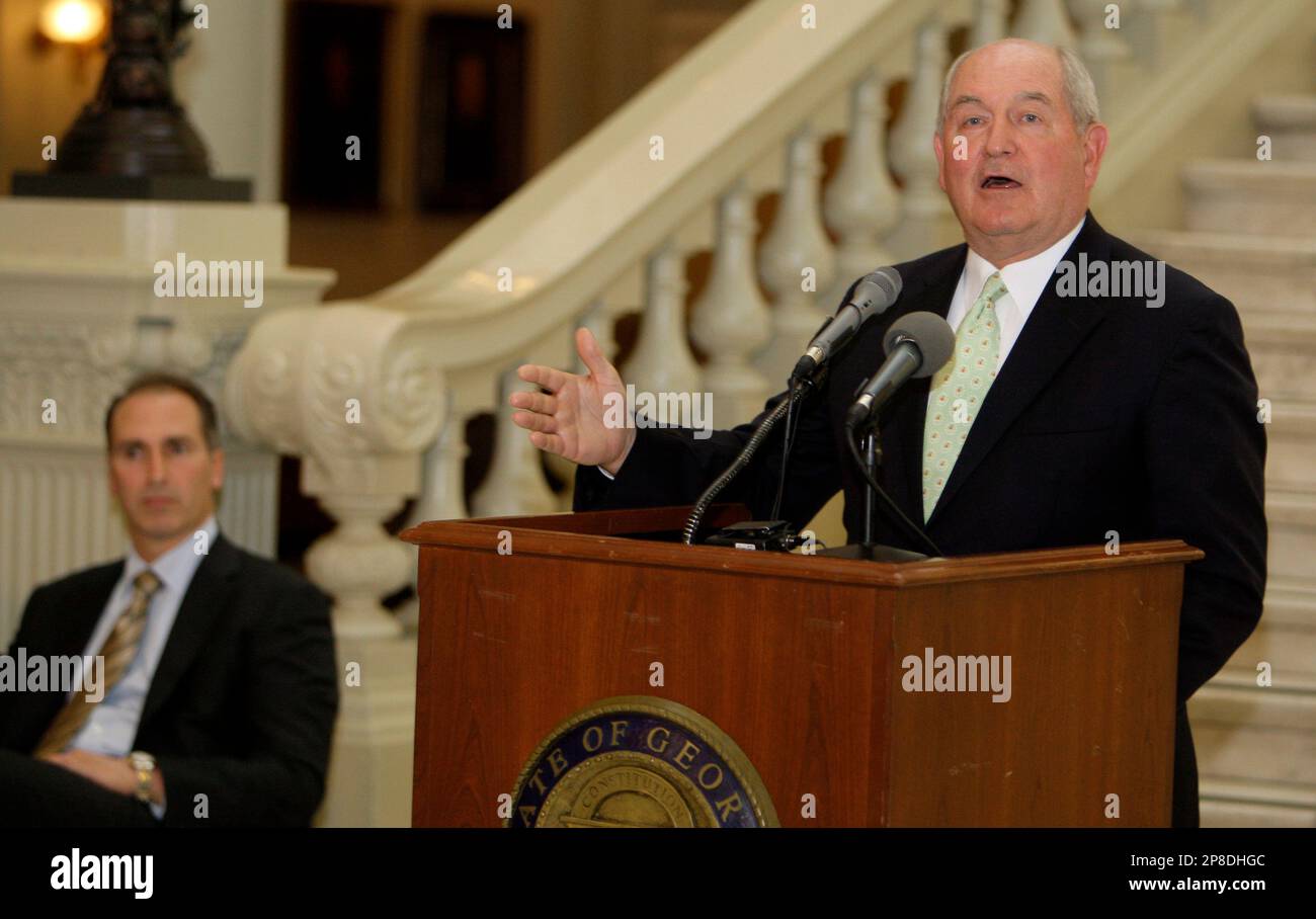 Georgia Gov. Sonny Perdue, right, speaks as NCR CEO and Chairman Bill ...