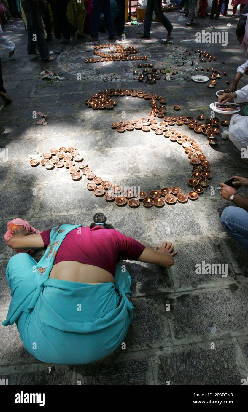 A Kashmiri Hindu devotee prays at the historic Kheer Bhawani temple in ...