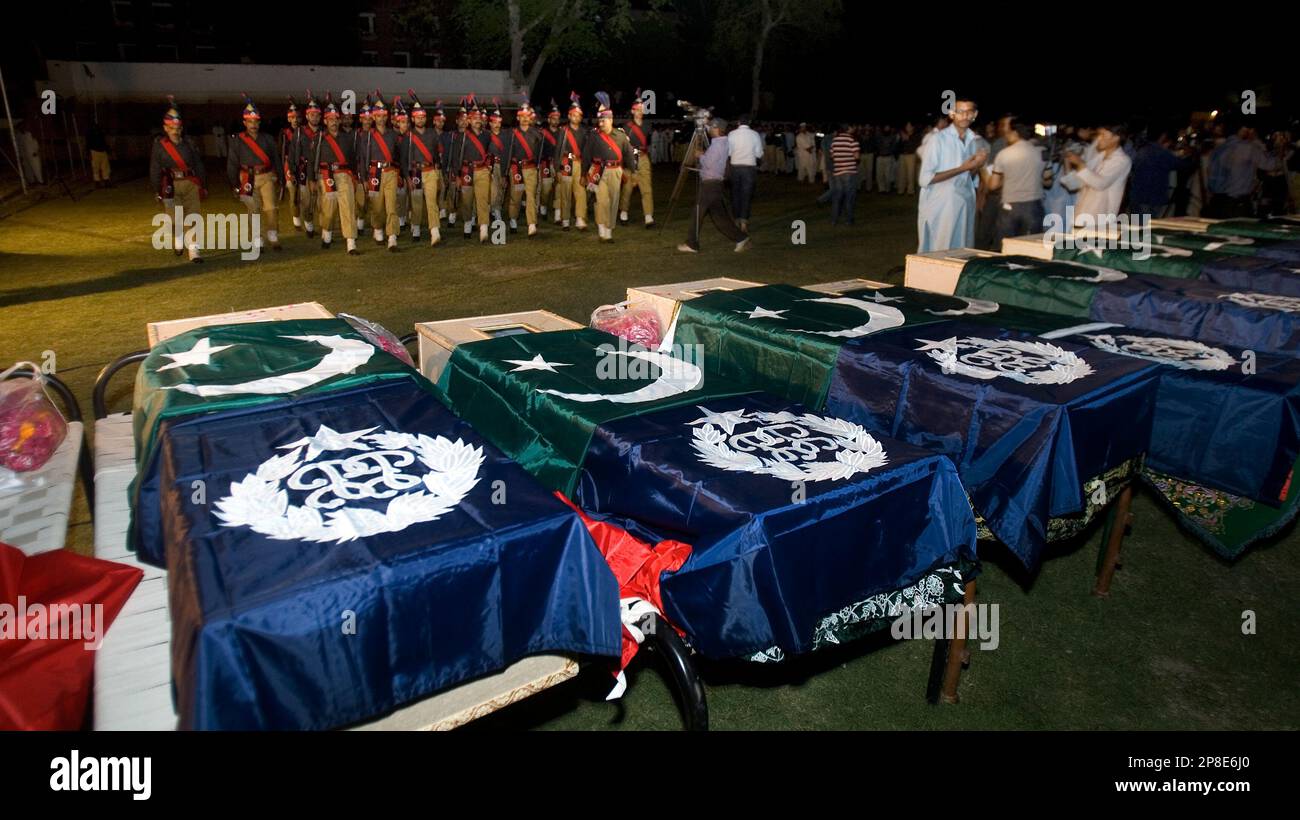 Pakistani police officers pay tribute to their colleagues killed by an explosion in Lahore ...