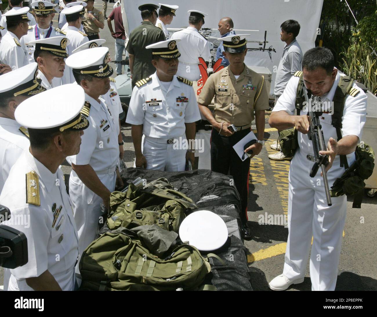 A Philippine Navy officer demonstrates the capability of a Philippine ...