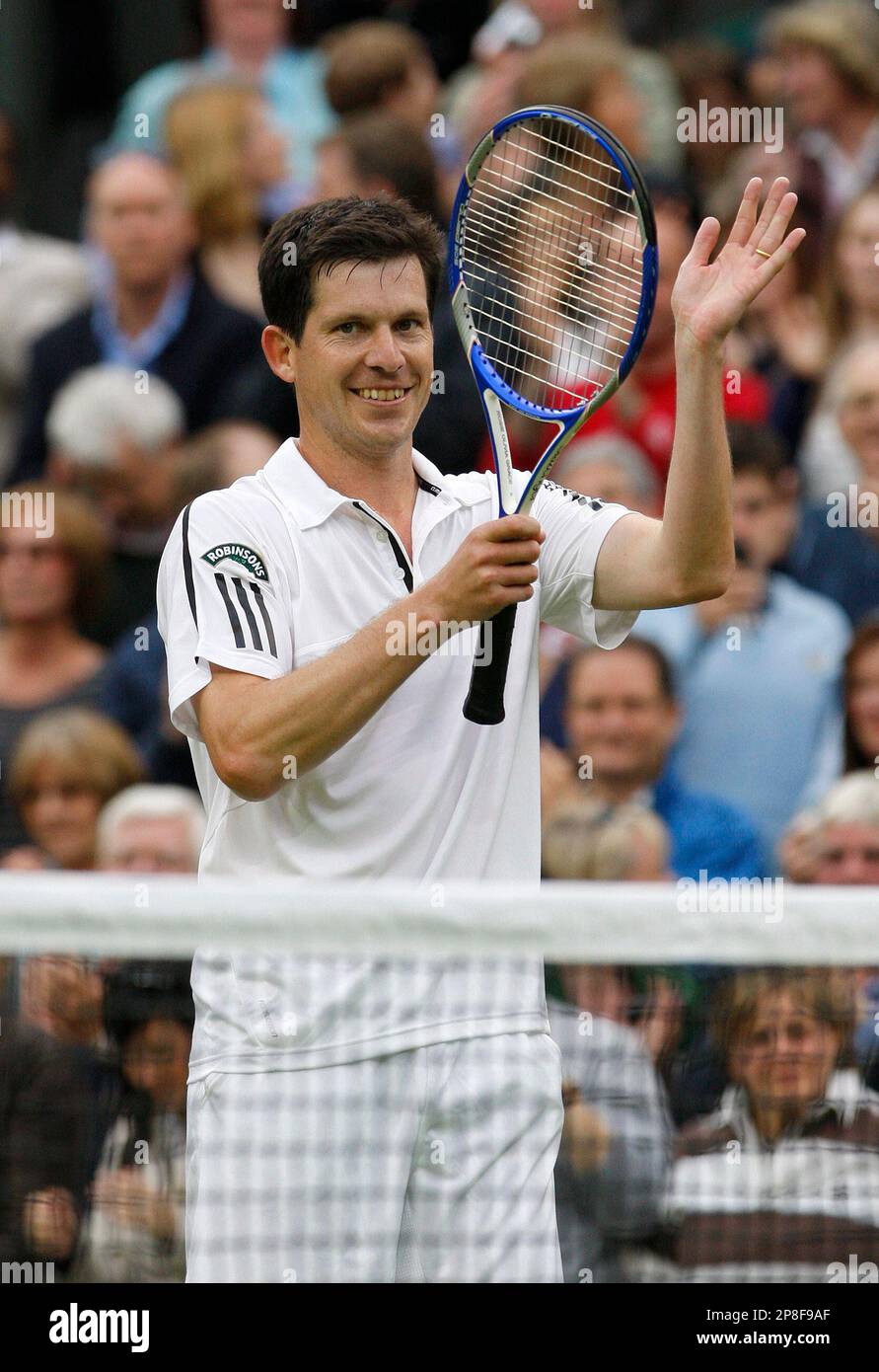 Former British tennis player Tim Henman, reacts, during their mixed ...