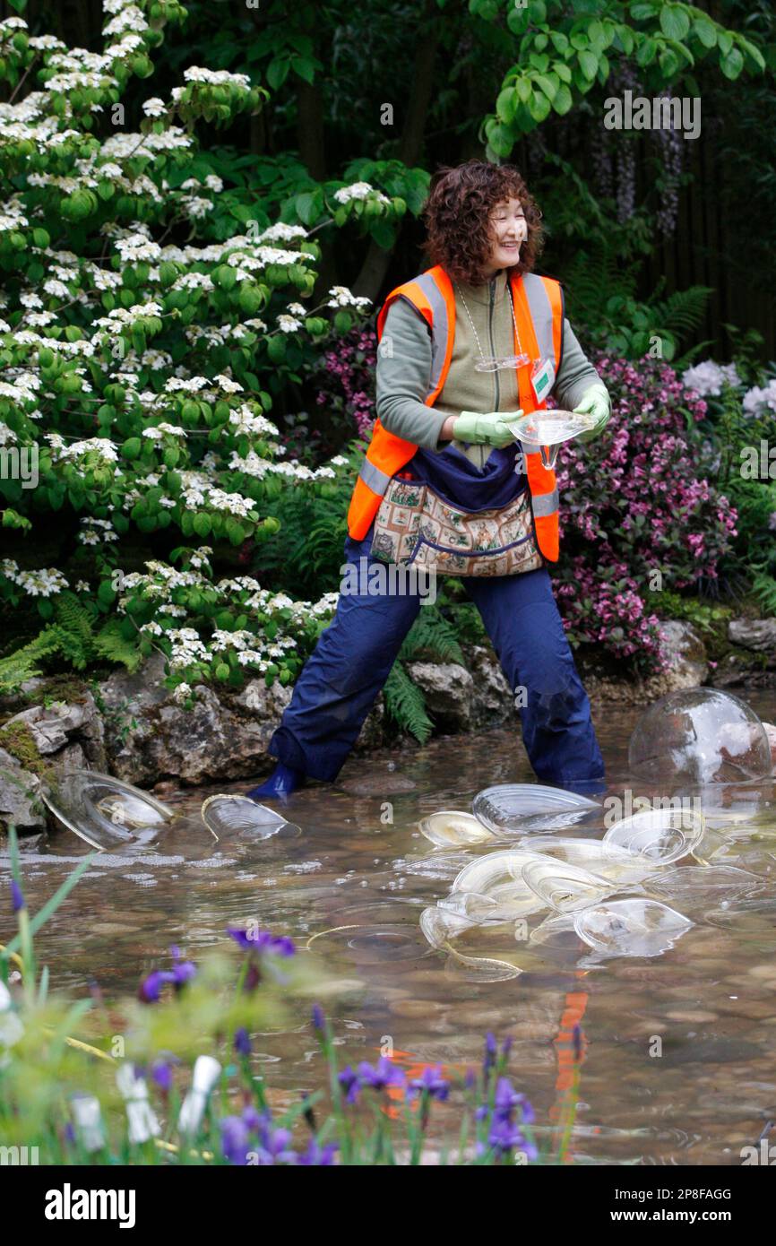 Japanese designer, Kay Yamada reacts as she works on her show garden ...