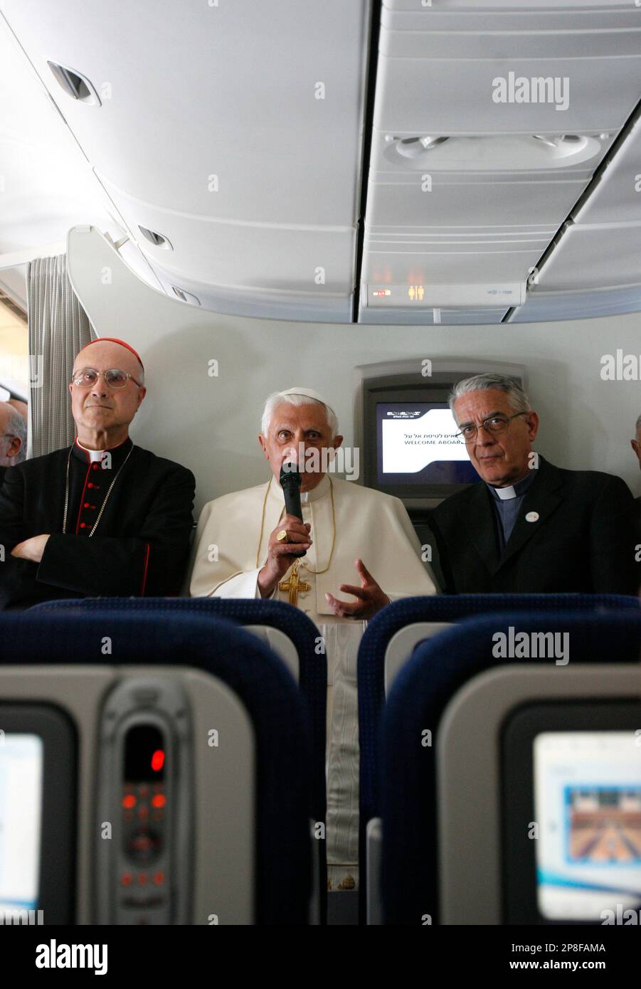 Pope Benedict XVI, center, is flanked by Vatican Secretary of State ...