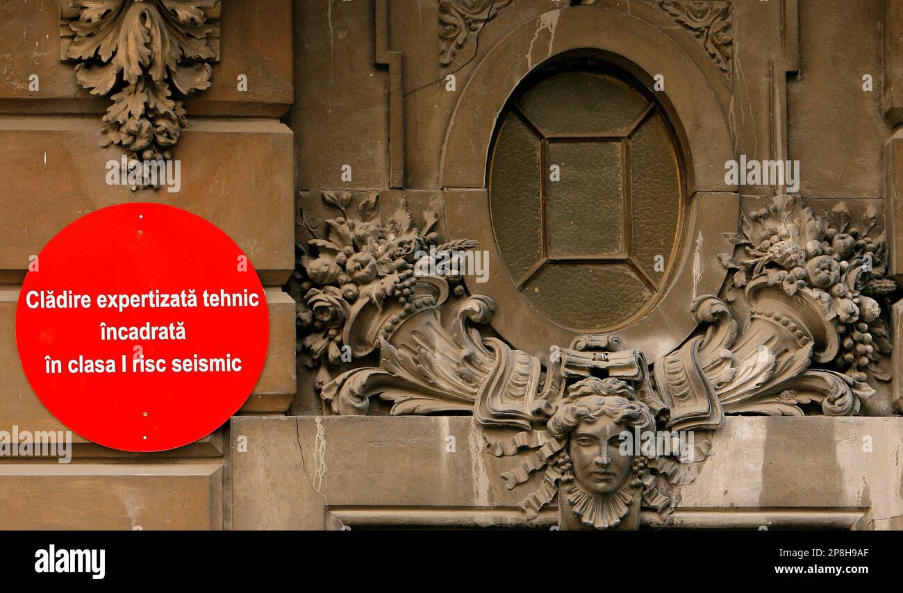 A building carries a sign that indicates risk of collapse in the case ...