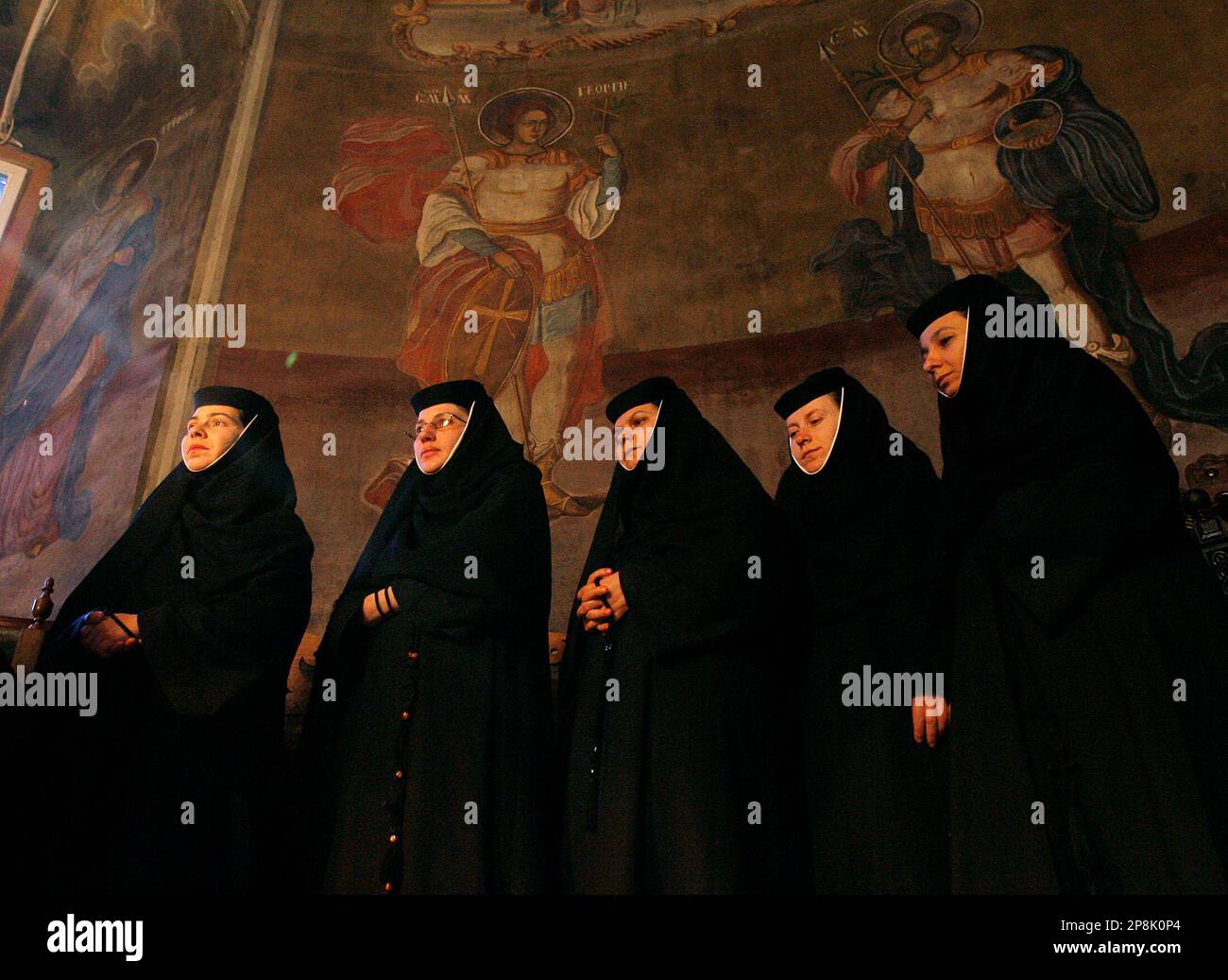 Romanian Orthodox nuns attend the Maundy Thursday religious service ...