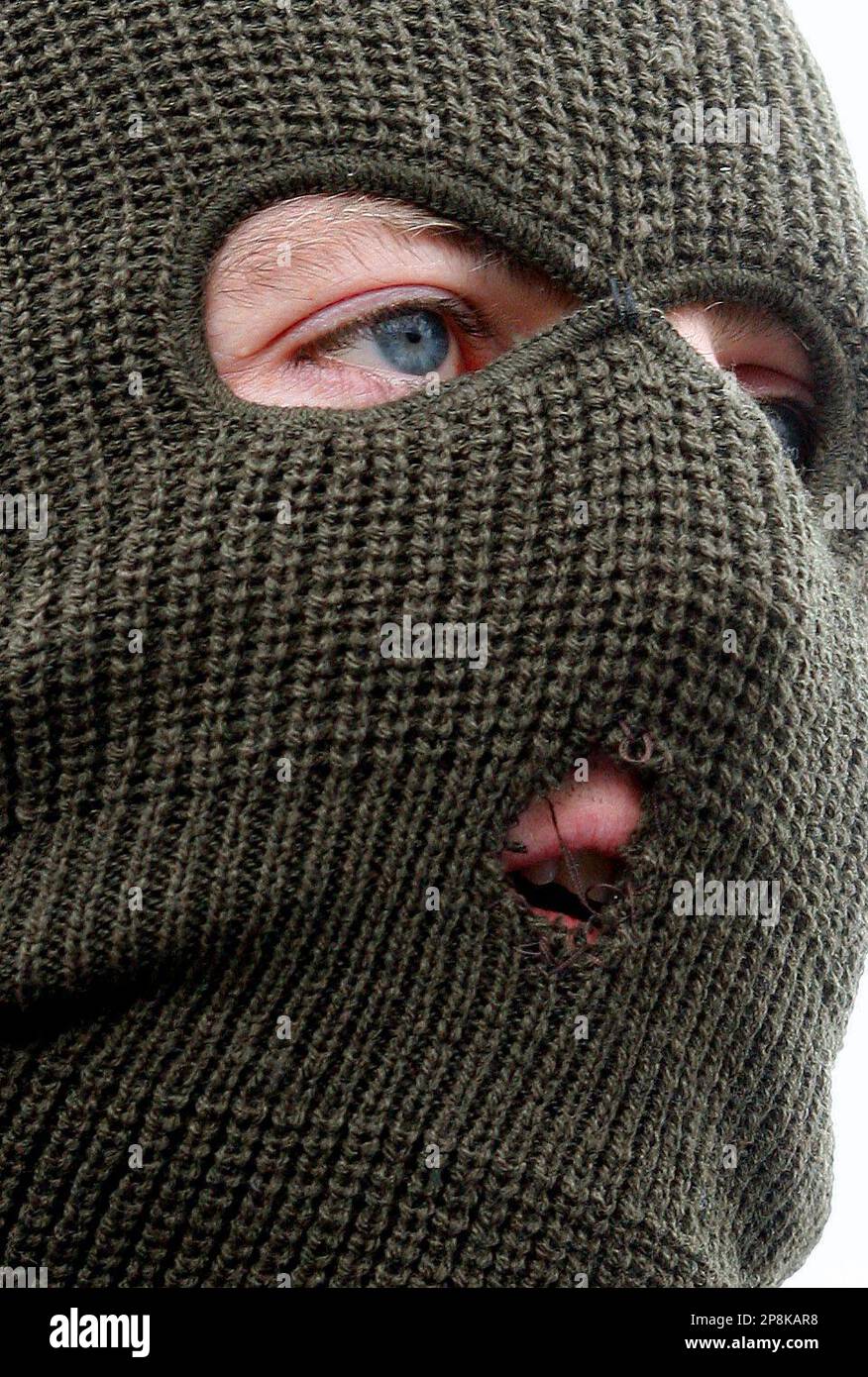 A member of the Real Irish Republican Army (RIRA) group reads out a ...