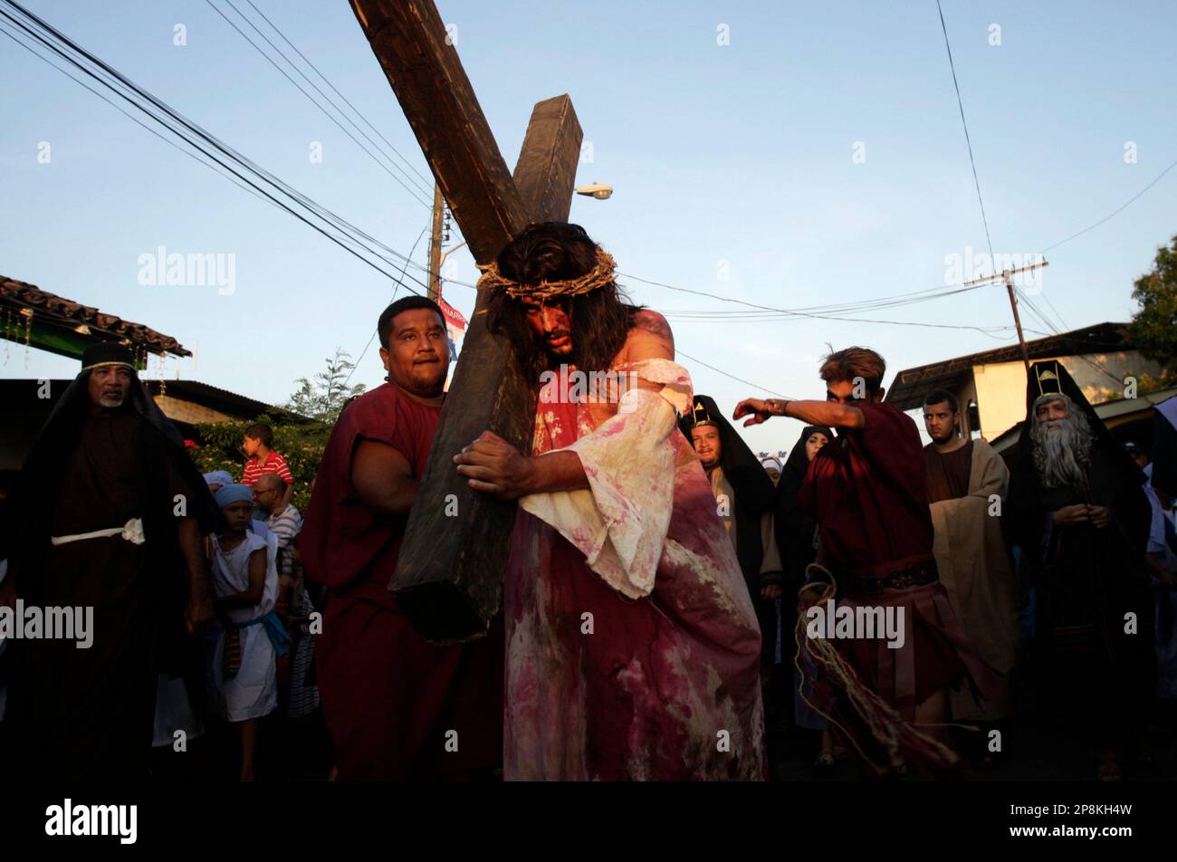 Faithful take part in a Via Crucis, Way of the Cross, procession during ...