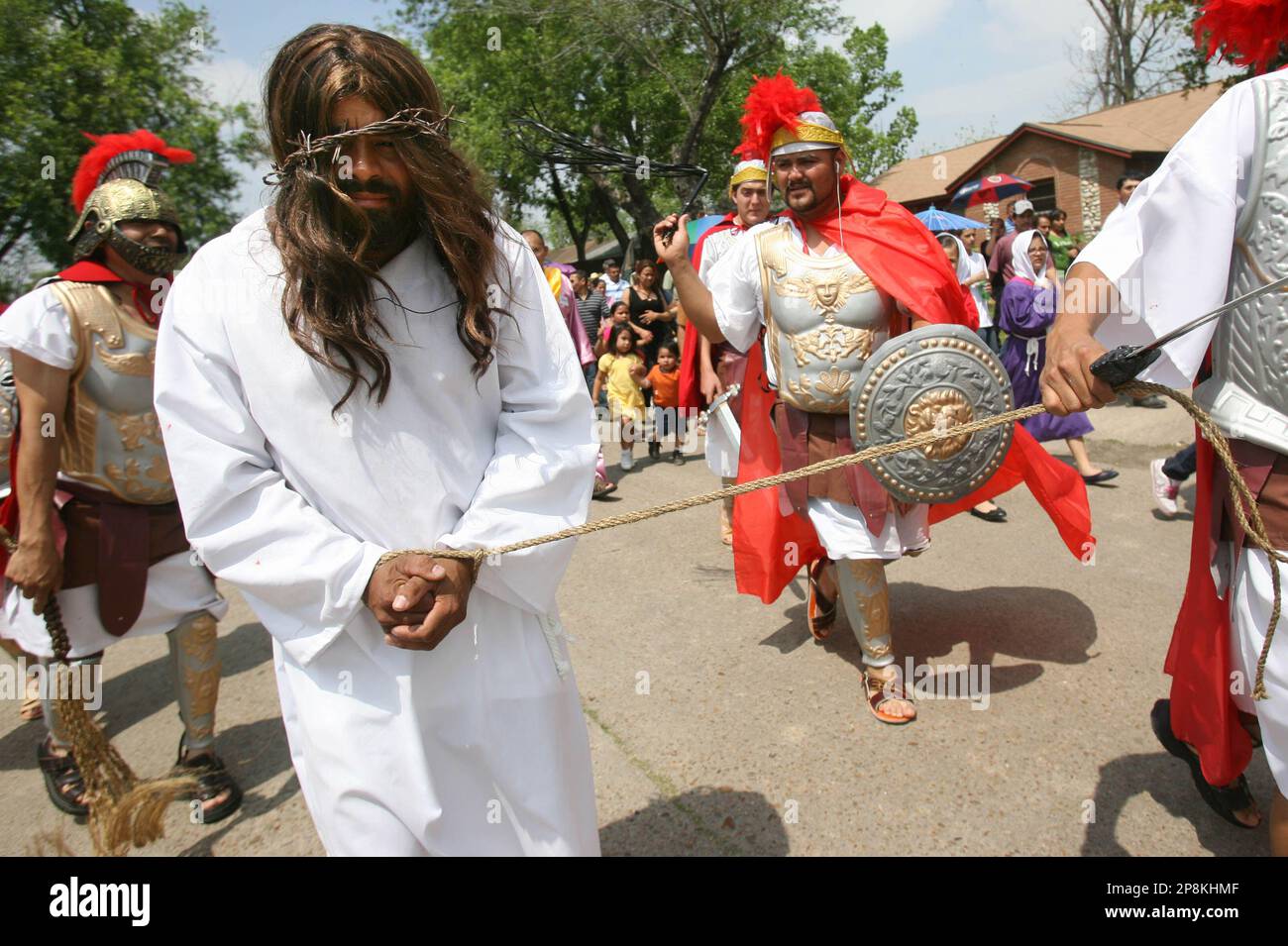 Pedro Corbera, portraying Jesus, is tied and whipped by Roman soldiers ...
