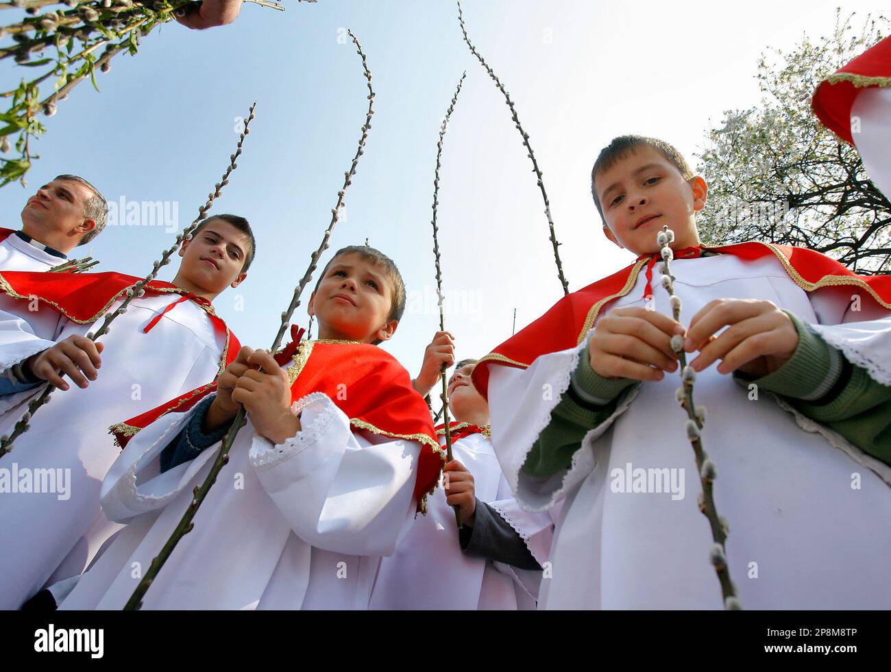 Romanian Catholic children hold branches in Bucharest, Romania, Sunday ...