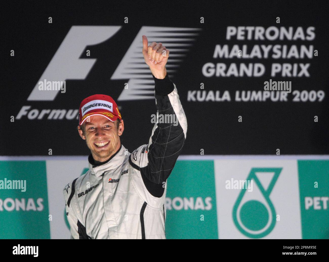 Brawn GP Formula One driver Jenson Button of Britain celebrates after ...