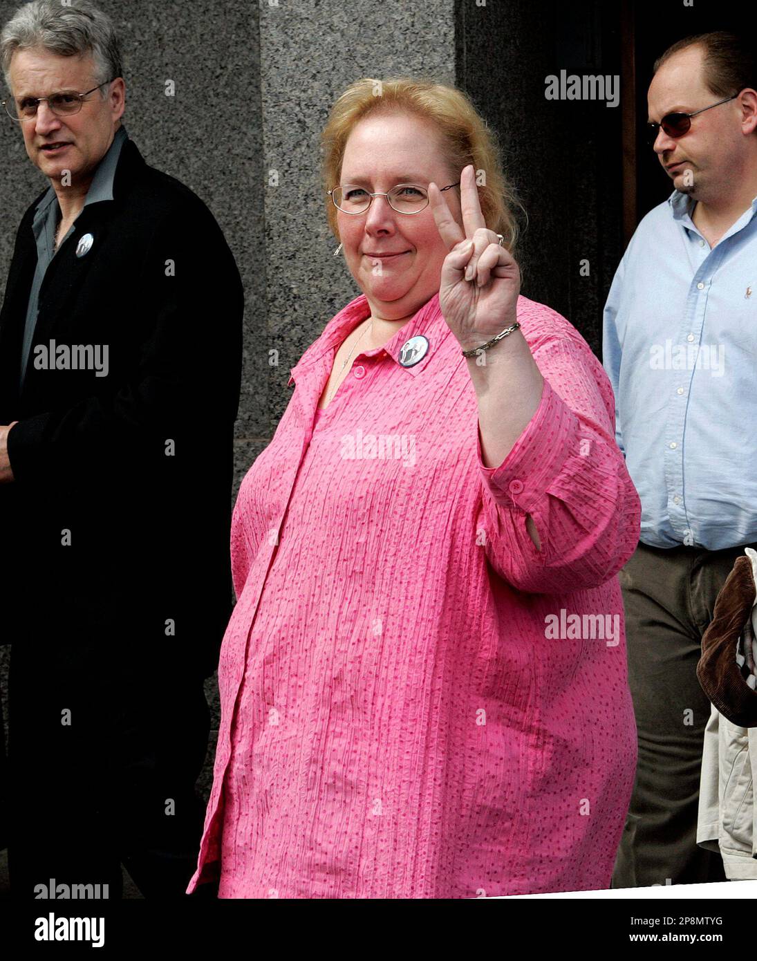 Deborah Haut, sister of murder-for-hire victim Robert Stears, flashes a ...