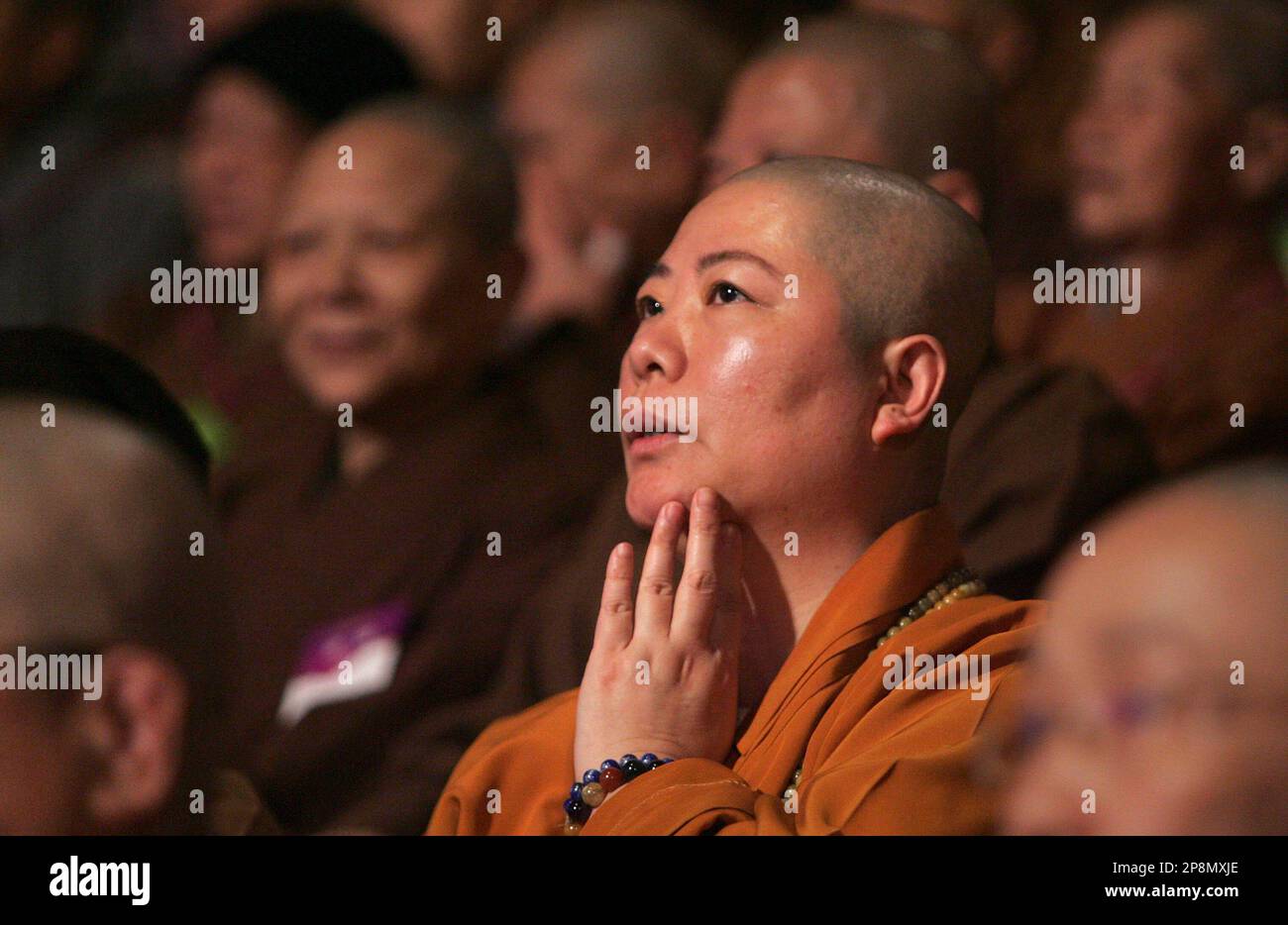 Buddhist nuns listen on during closing ceremonies of the second part of ...