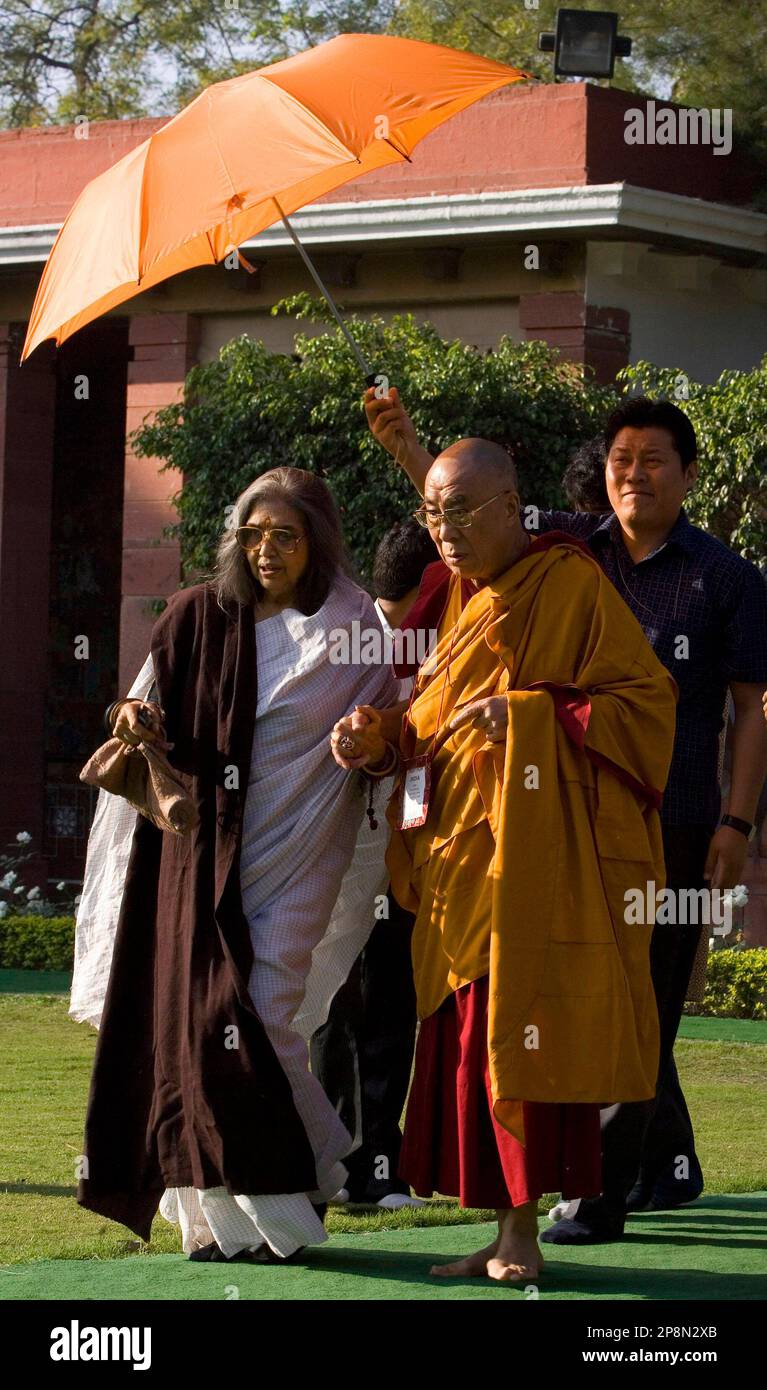 Tibet's exiled spiritual leader the Dalai Lama, right, arrives to pay ...