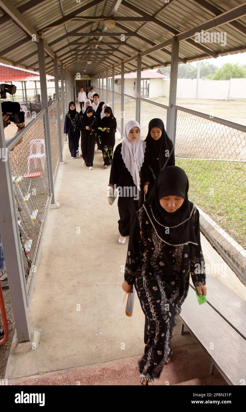 Cambodian Muslim students walk into the court room for a trial of a ...