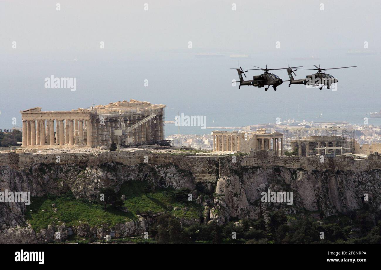 Apache helicopters fly over the area of Parthenon, on the ancient ...