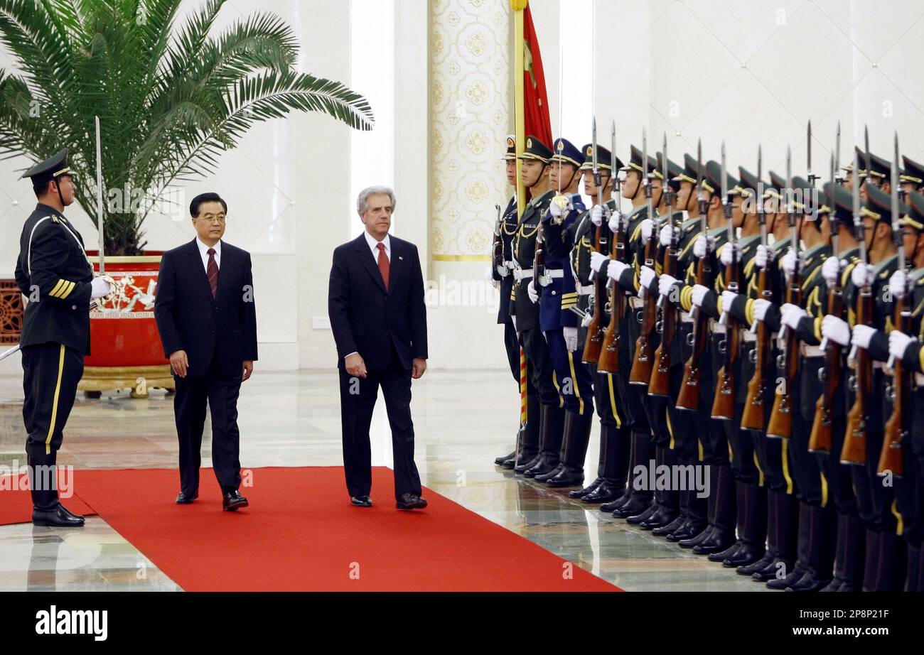 Uruguay's President Tabare Vazquez, center, reviews an honor guard with ...